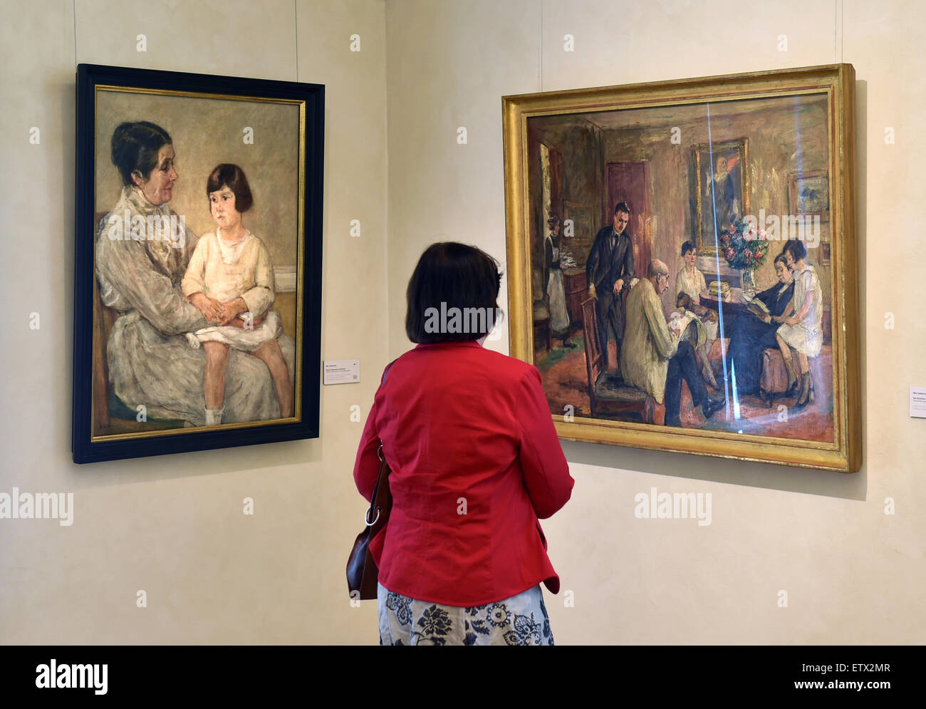 A woman looks at two paintings from Max Liebermann "Martha Liebermann ...