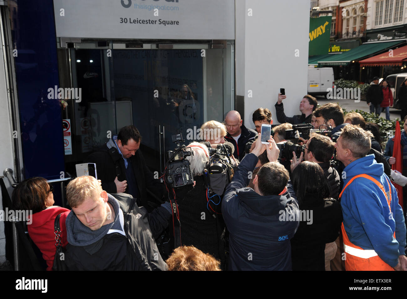 Boris Johnson is confronted by the press as he leaves Global House ...