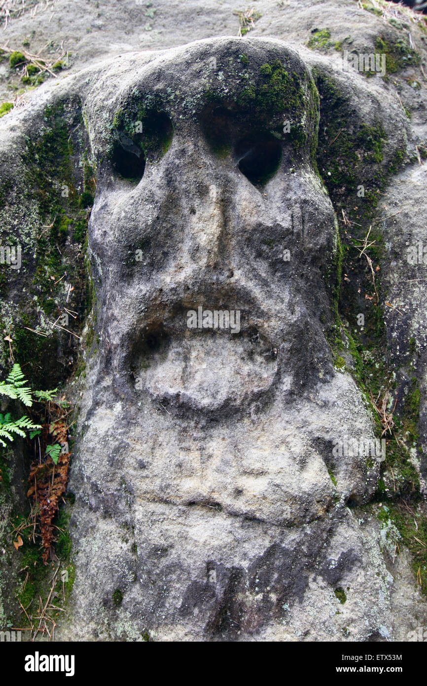 Scary Stone Head - rock sculpture in the forest Stock Photo - Alamy