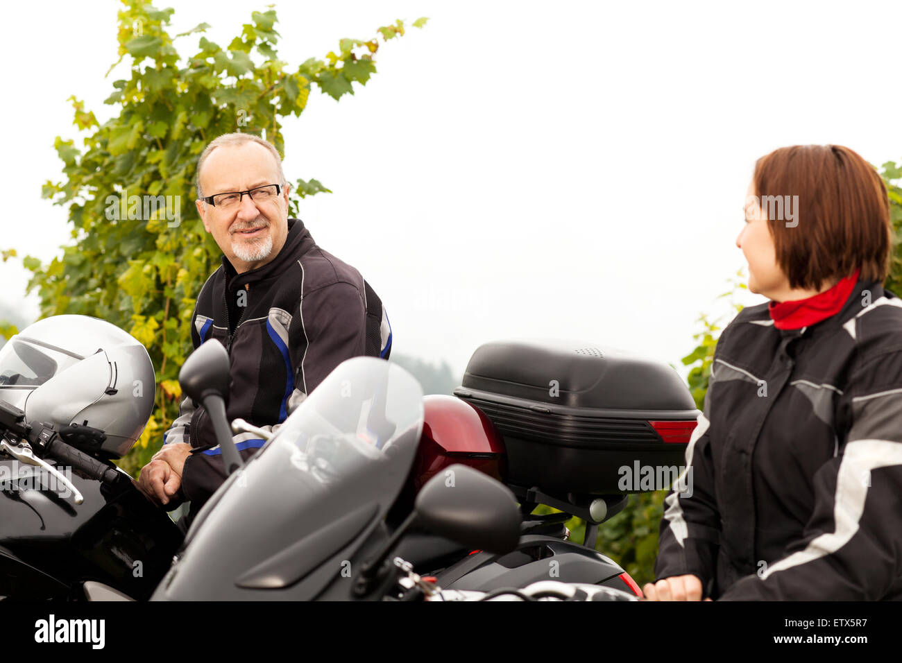 Motorcyclists are talking Stock Photo - Alamy
