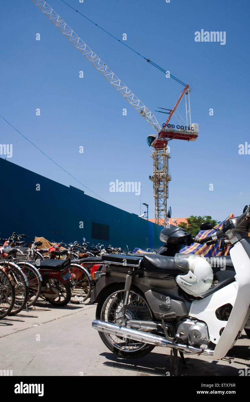 Construction workers' motorcycles are parked at a construction site in ...
