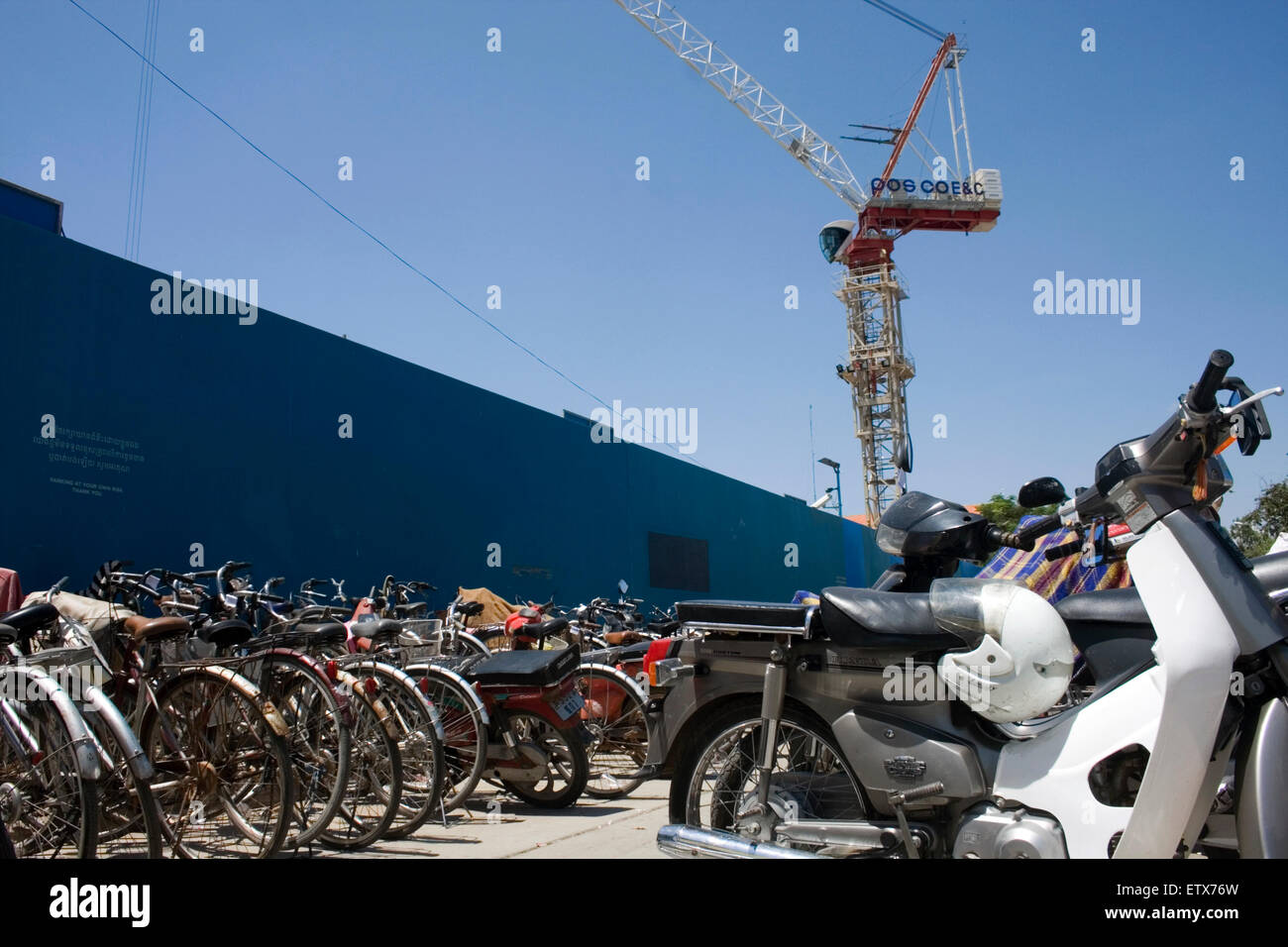 Construction workers' motorcycles are parked at a construction site ...