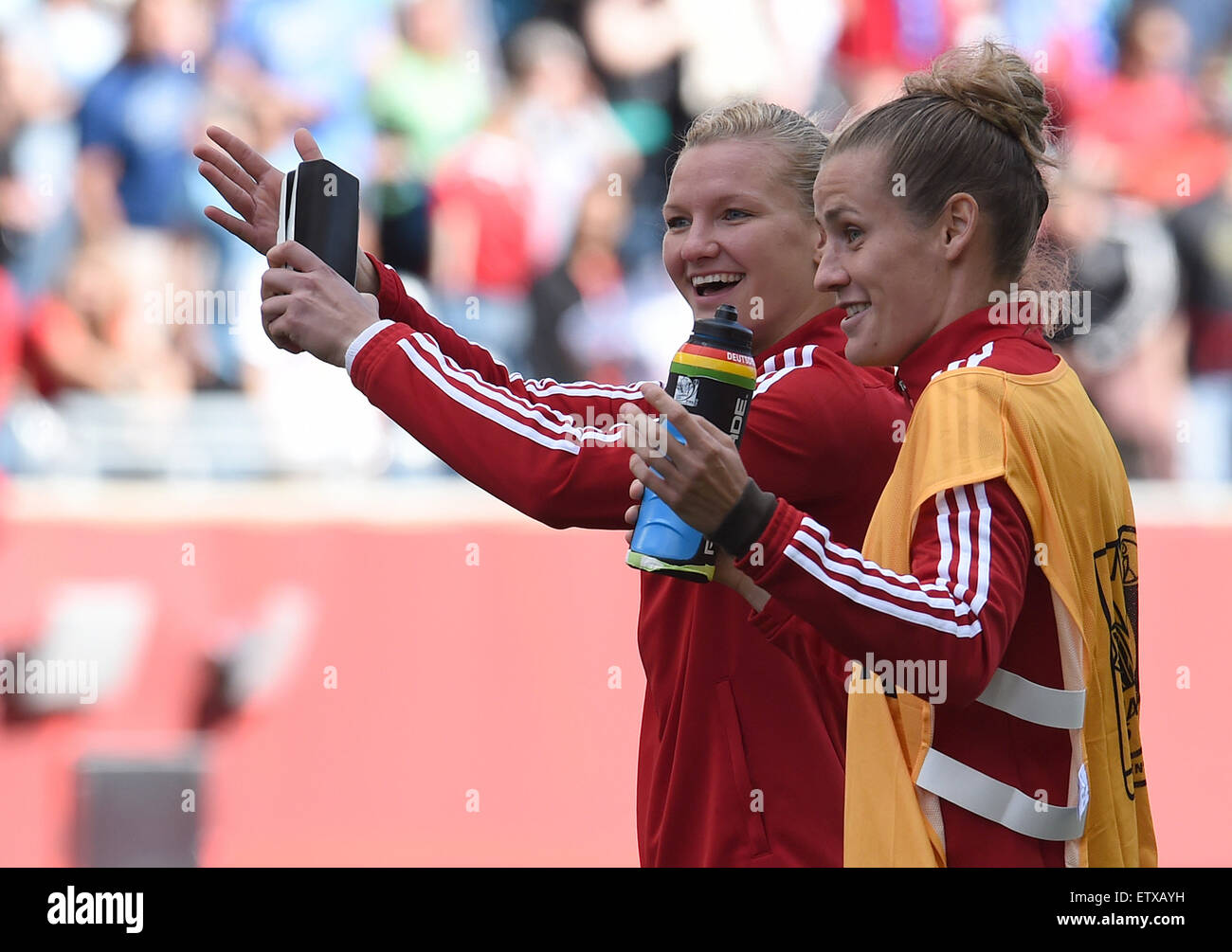 Germany's Alexandra Popp (L) and Simone Laudehr celebrate her victory ...