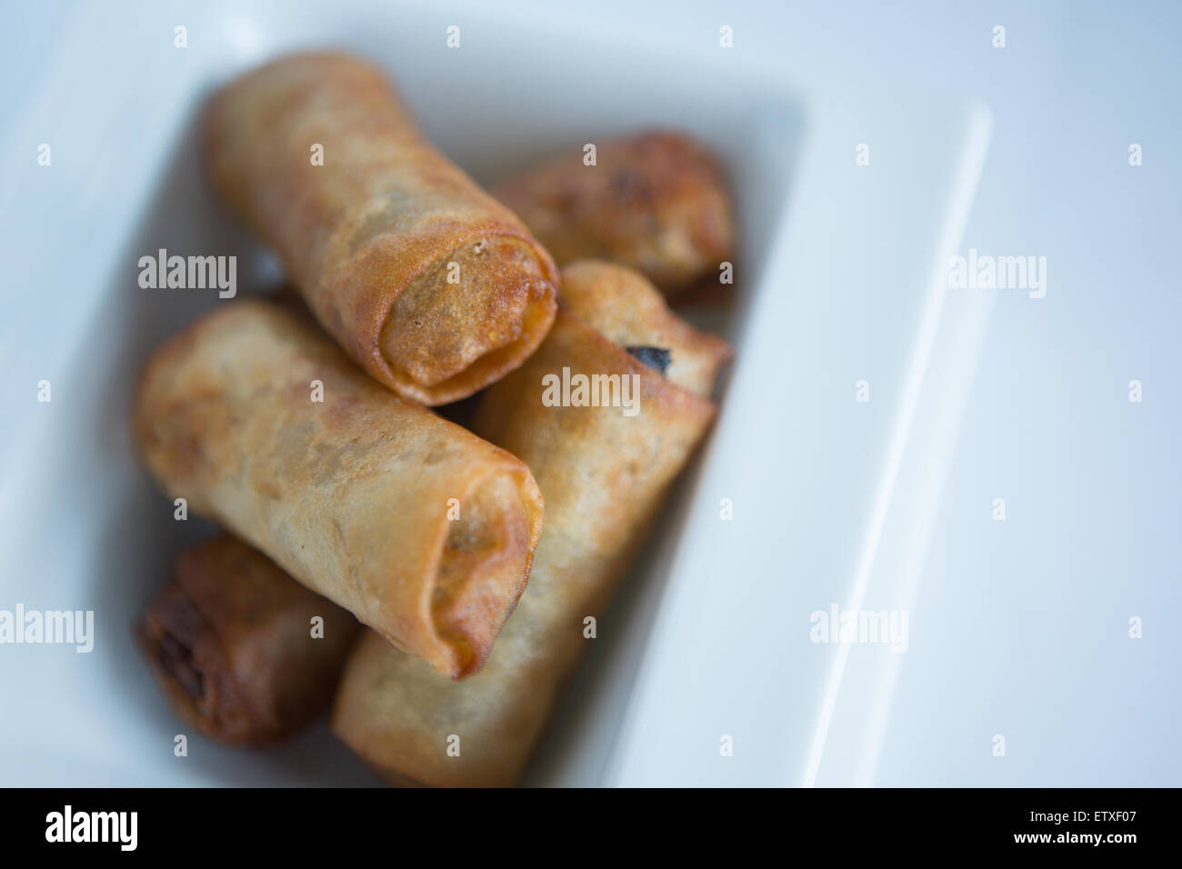 Crispy vegetable spring rolls served with a tamarind dipping sauce ...