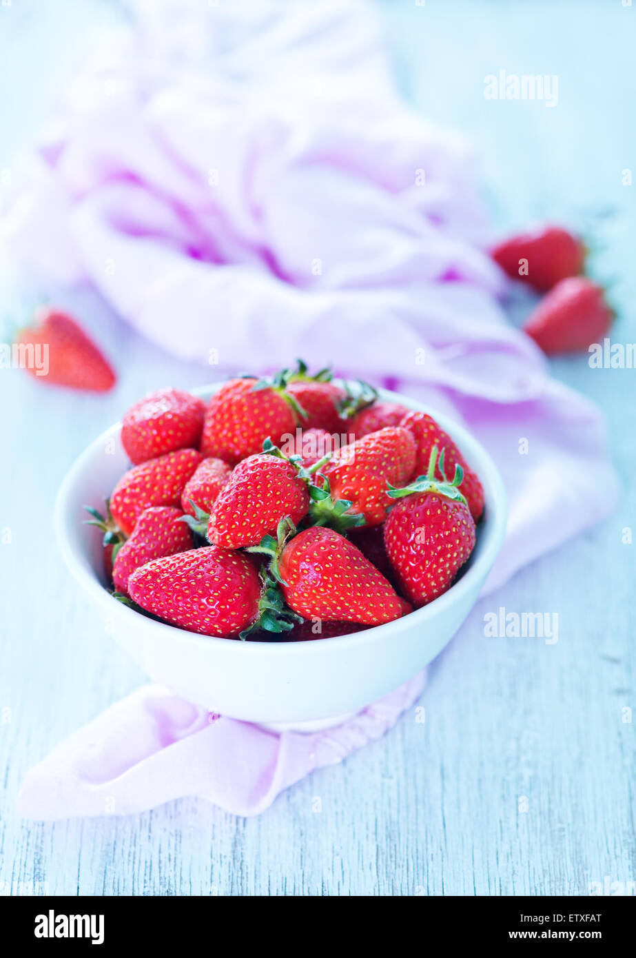 fresh strawberry in bowl and on a table Stock Photo - Alamy