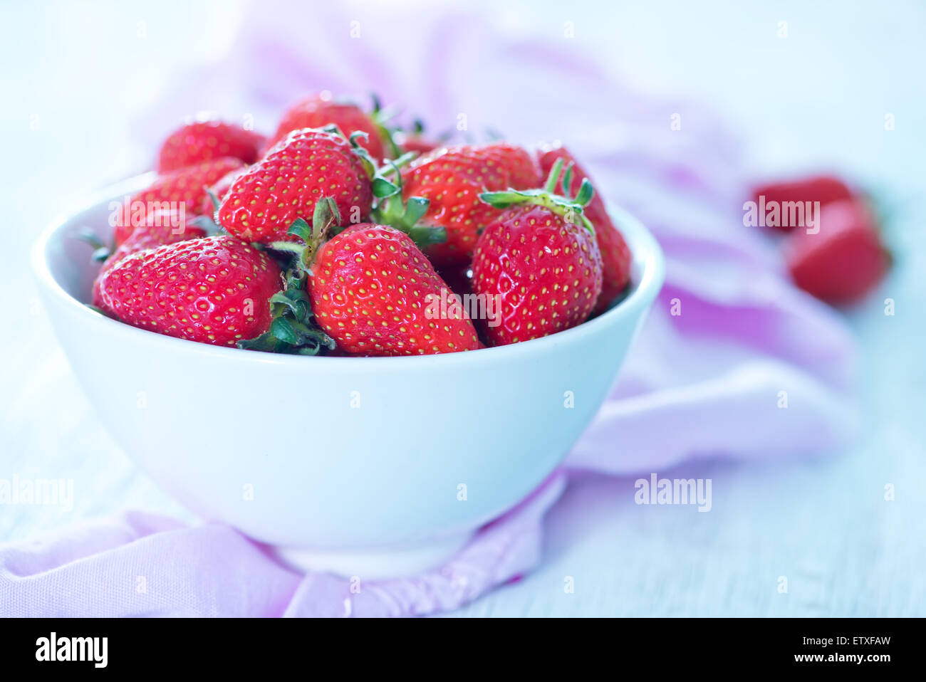 fresh strawberry in bowl and on a table Stock Photo - Alamy