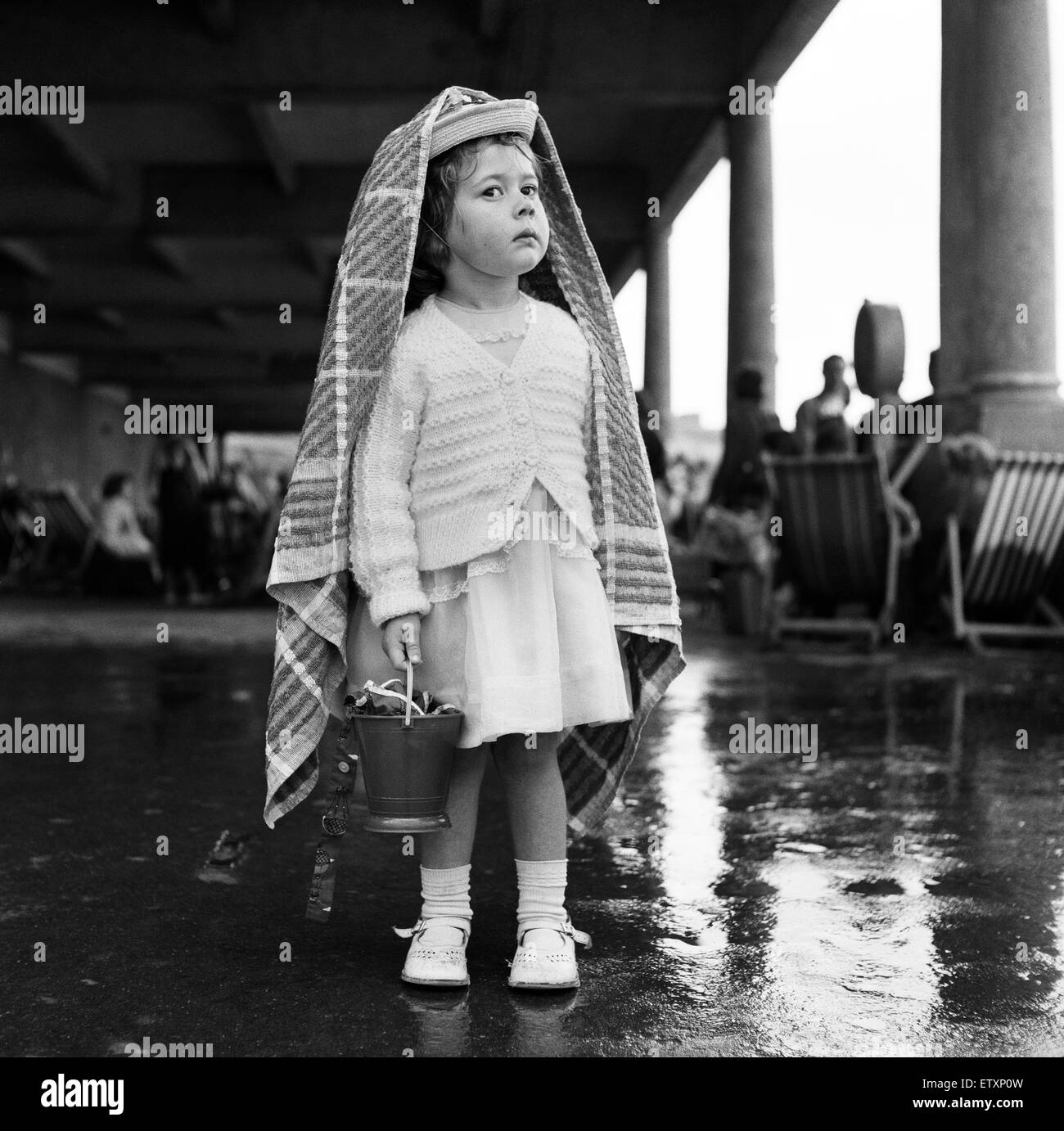 1960s girl rain Black and White Stock Photos & Images - Alamy