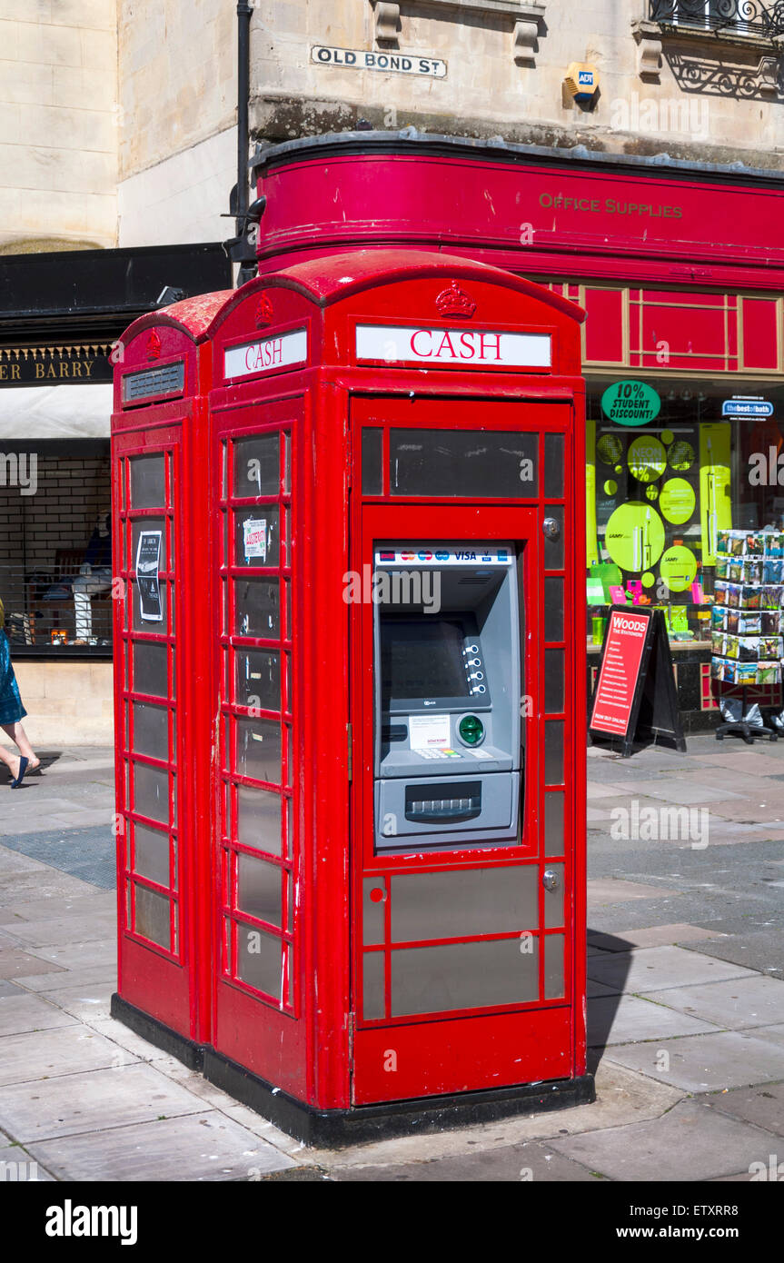 Old traditional red telephone box converted for use as ATM Stock Photo ...