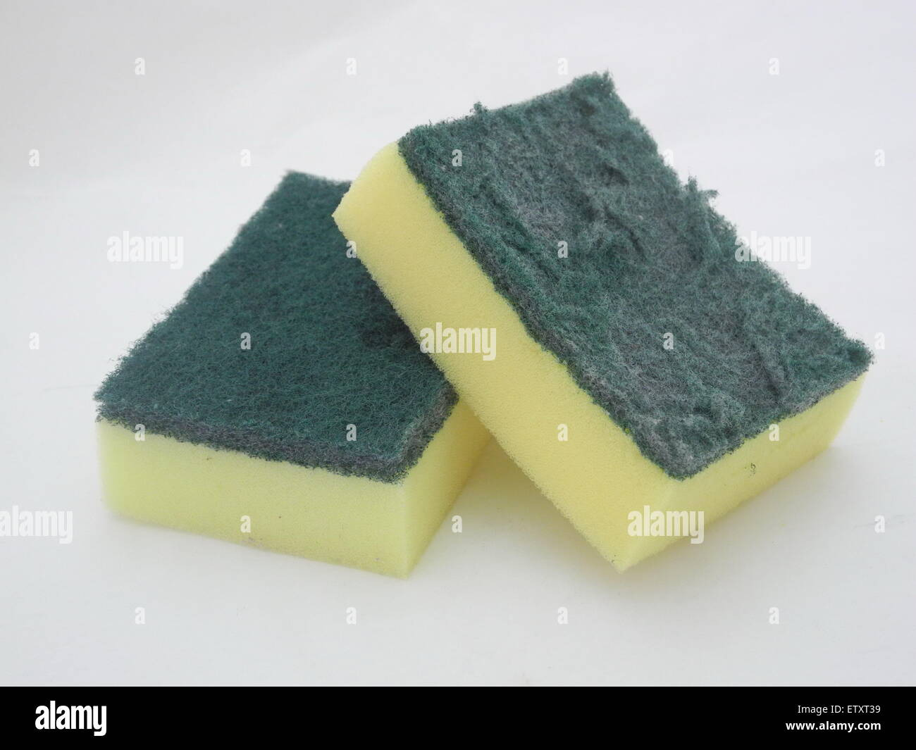 Sponge washing dishes in the kitchen Stock Photo - Alamy