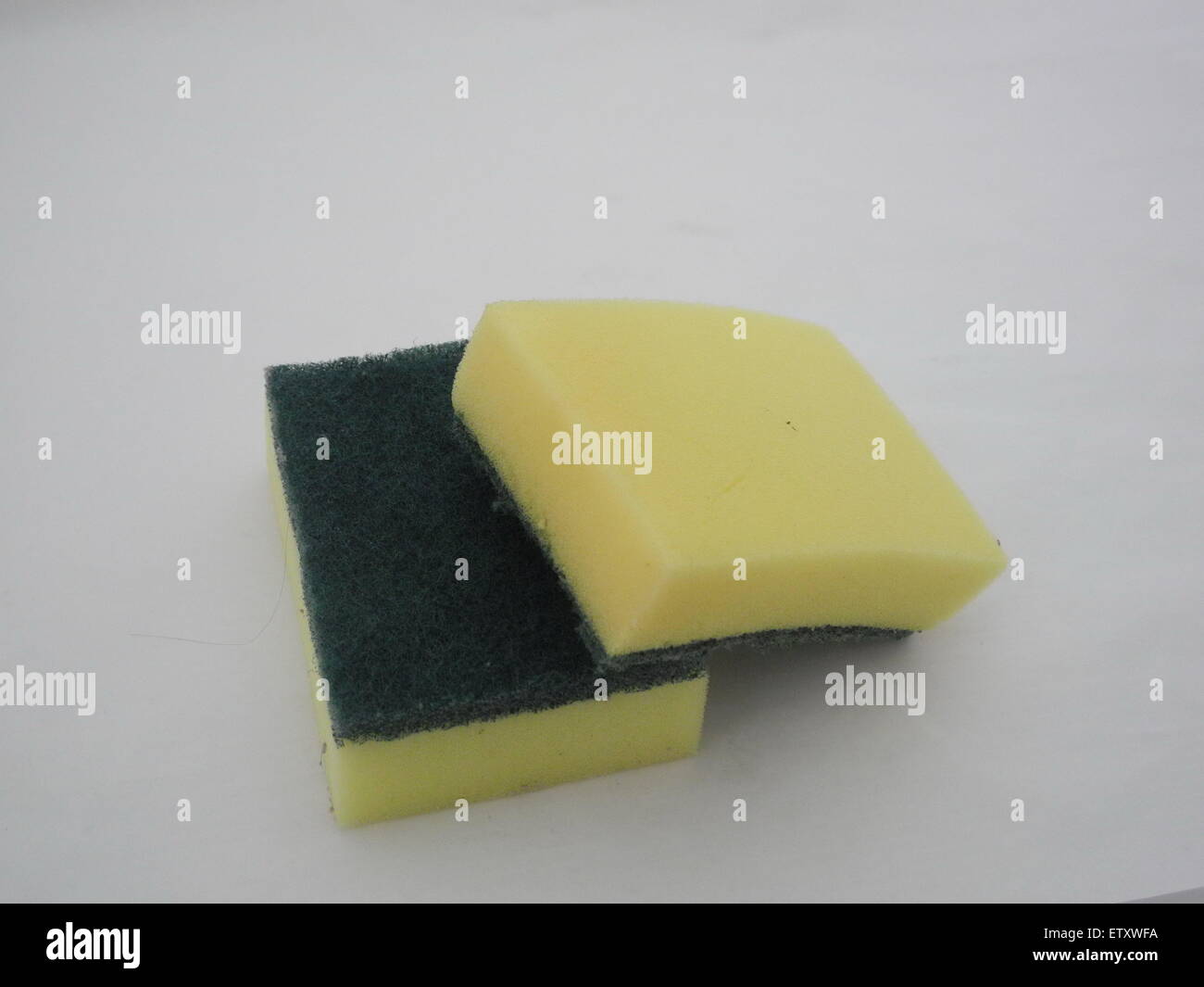 Sponge washing dishes in the kitchen Stock Photo - Alamy