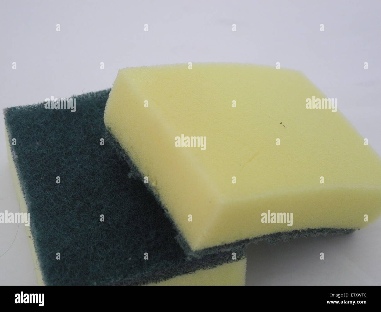 Sponge washing dishes in the kitchen Stock Photo - Alamy