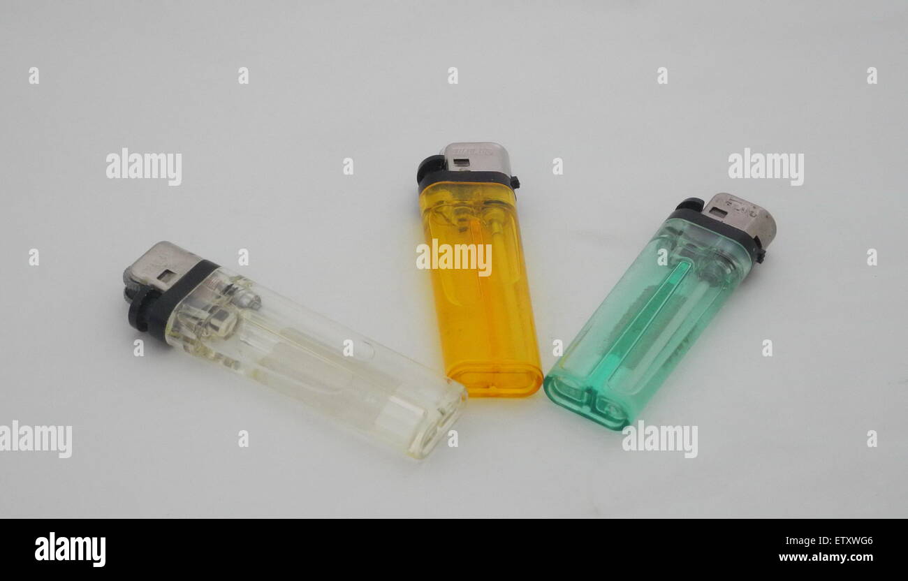 Colorful lighters isolated on white background Stock Photo - Alamy