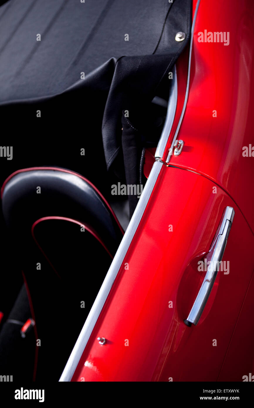 Close up on a leather seat and red body car Stock Photo - Alamy