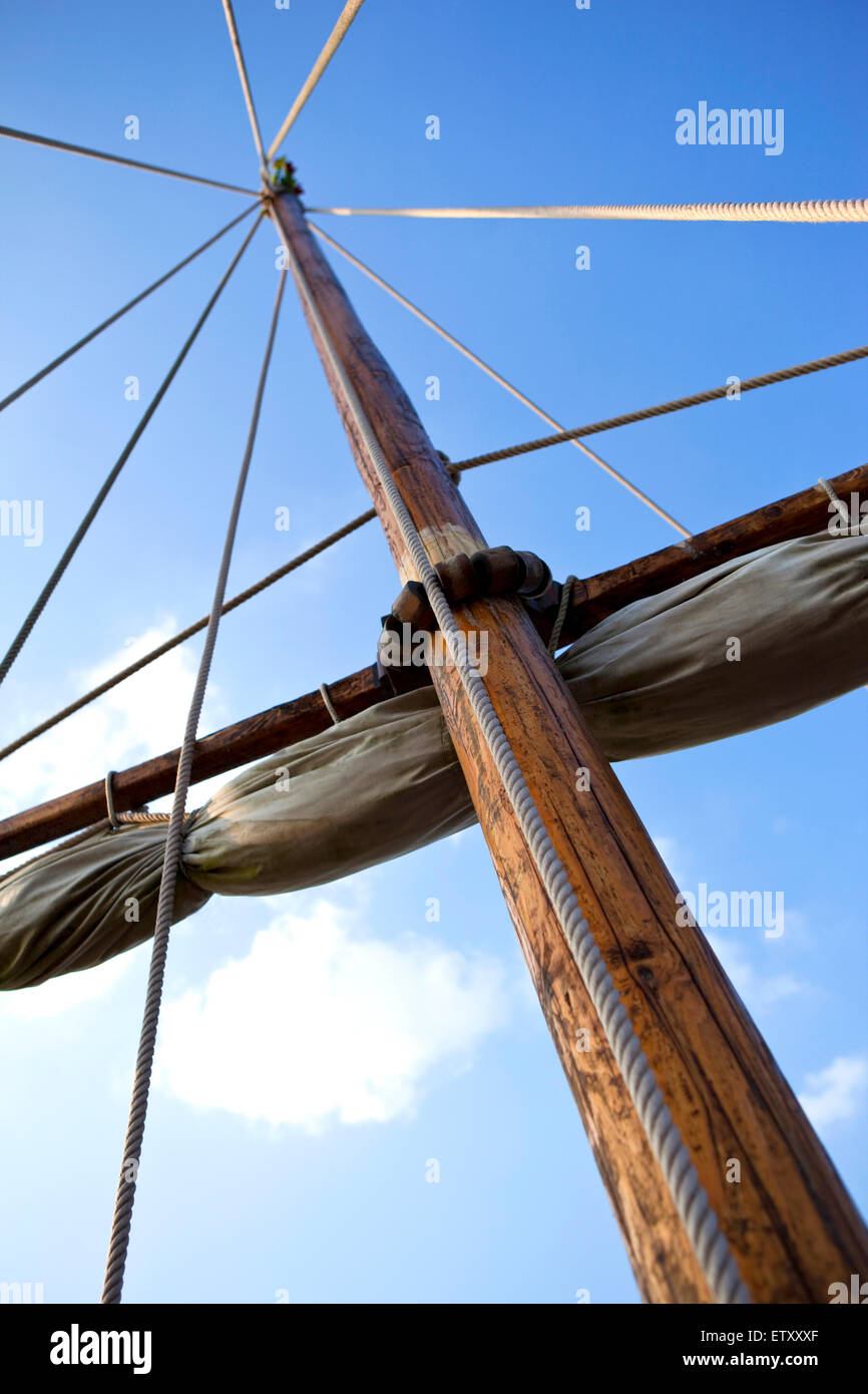 Mast and sail of an old wooden sailboat Stock Photo - Alamy