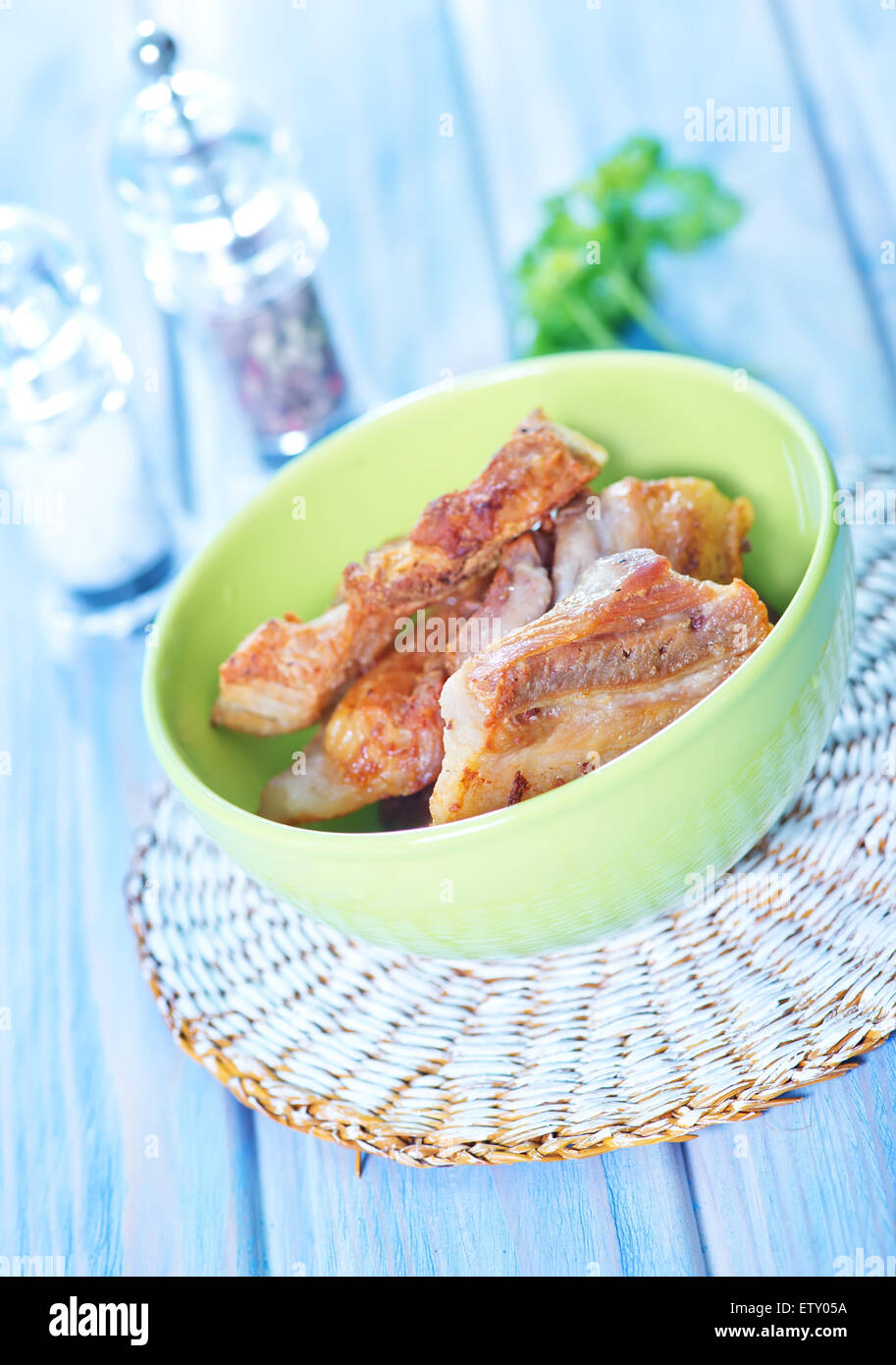 fried meat in bowl and on a table Stock Photo - Alamy