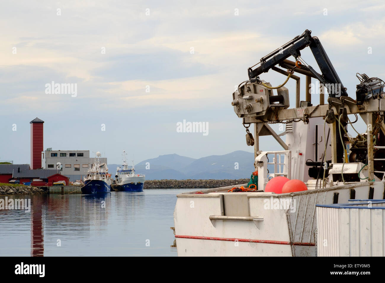 The small Arctic fishing harbor of Honningsvaag at the North cape of ...