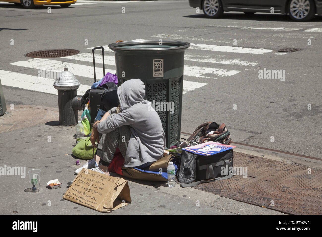Homeless woman sitting on street hi-res stock photography and images ...
