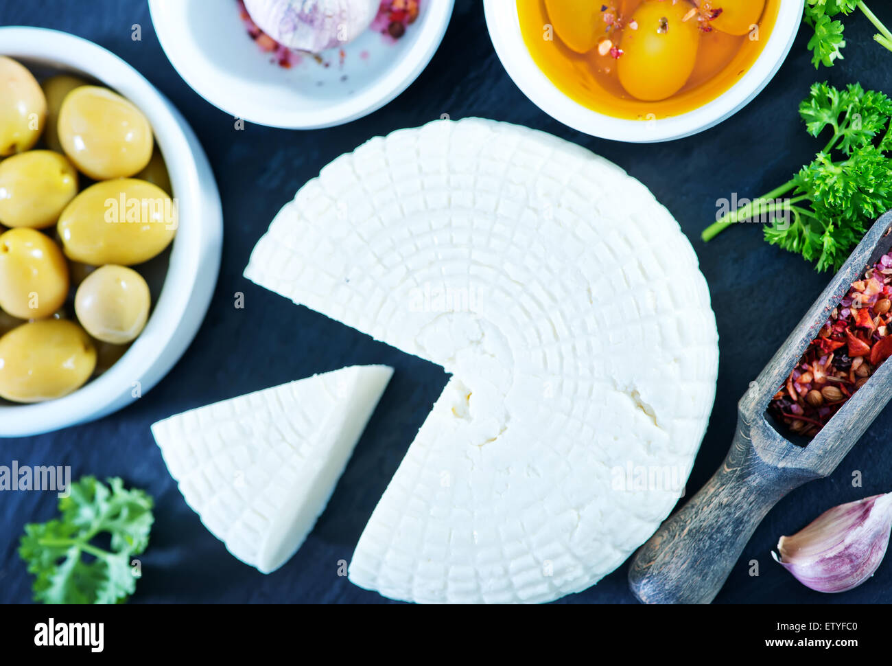 cheese with olives and oil in bowl Stock Photo - Alamy