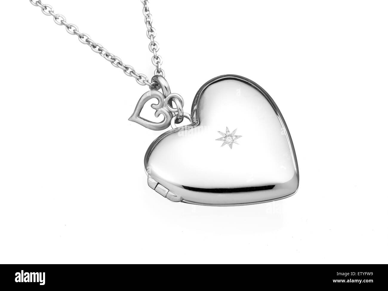 Silver locket with diamond Stock Photo - Alamy