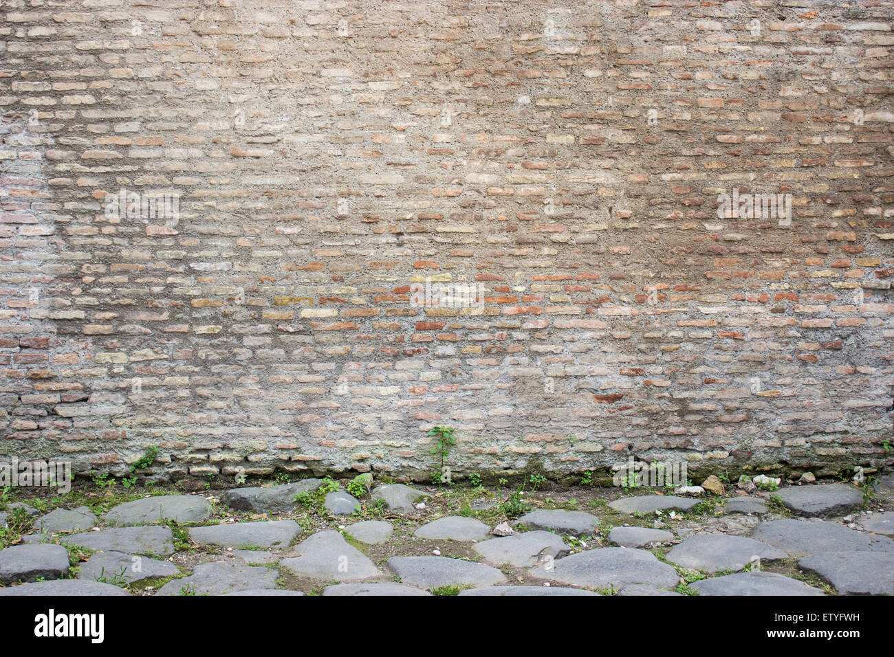Antique stone wall behind a Roman pavement Stock Photo - Alamy