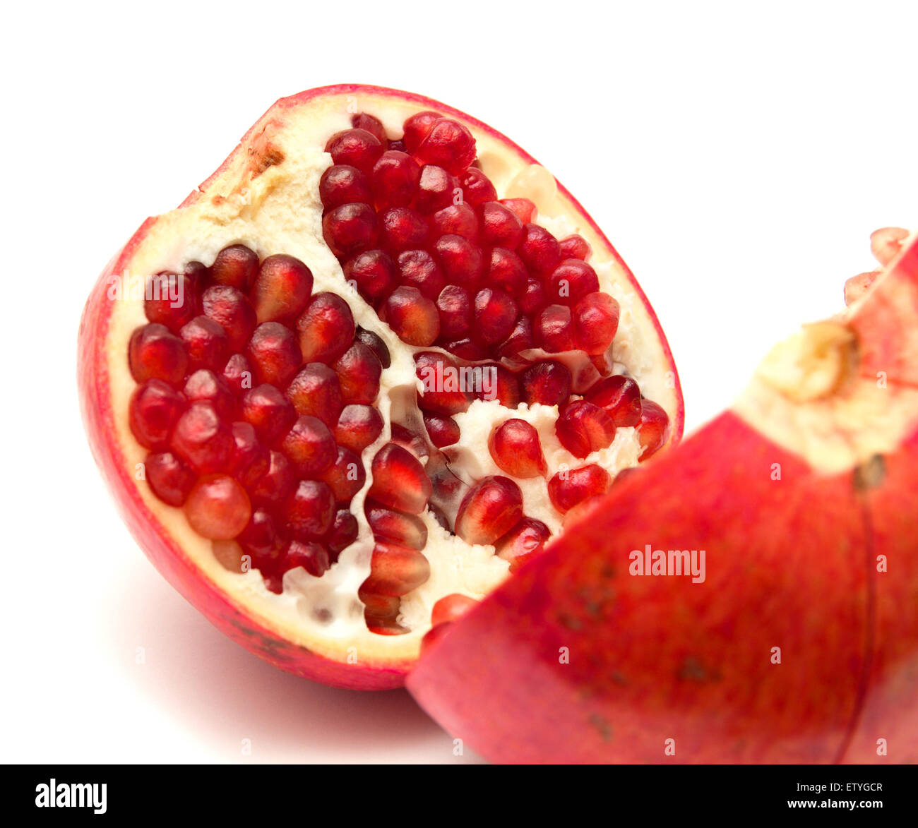 pomegranate fruit split in two, isolated on white background Stock ...