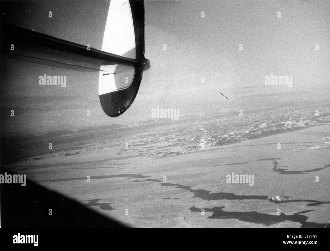 This image shows a view from a Lockheed Learstar aircraft, offering a ...