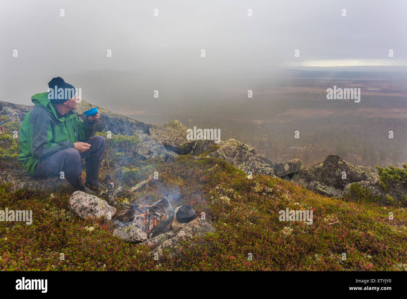 Old man watching fire hi-res stock photography and images - Alamy