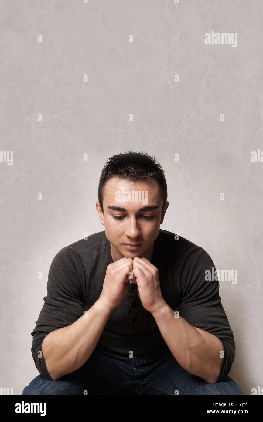 sad man looking down Stock Photo - Alamy