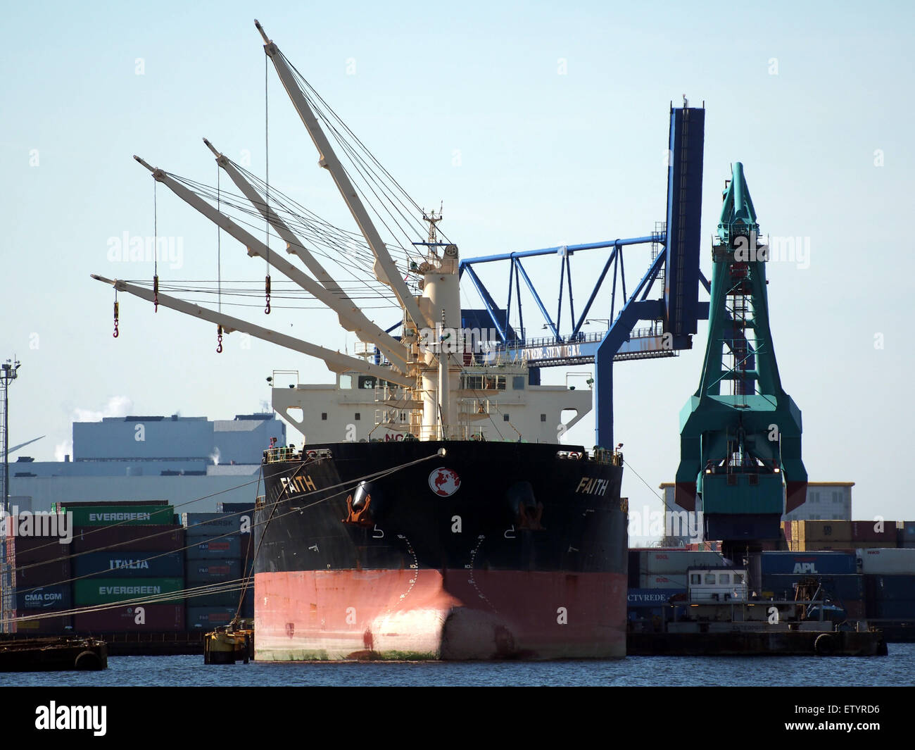 The tanker ship Faith, identified by its IMO number, is docked at ...