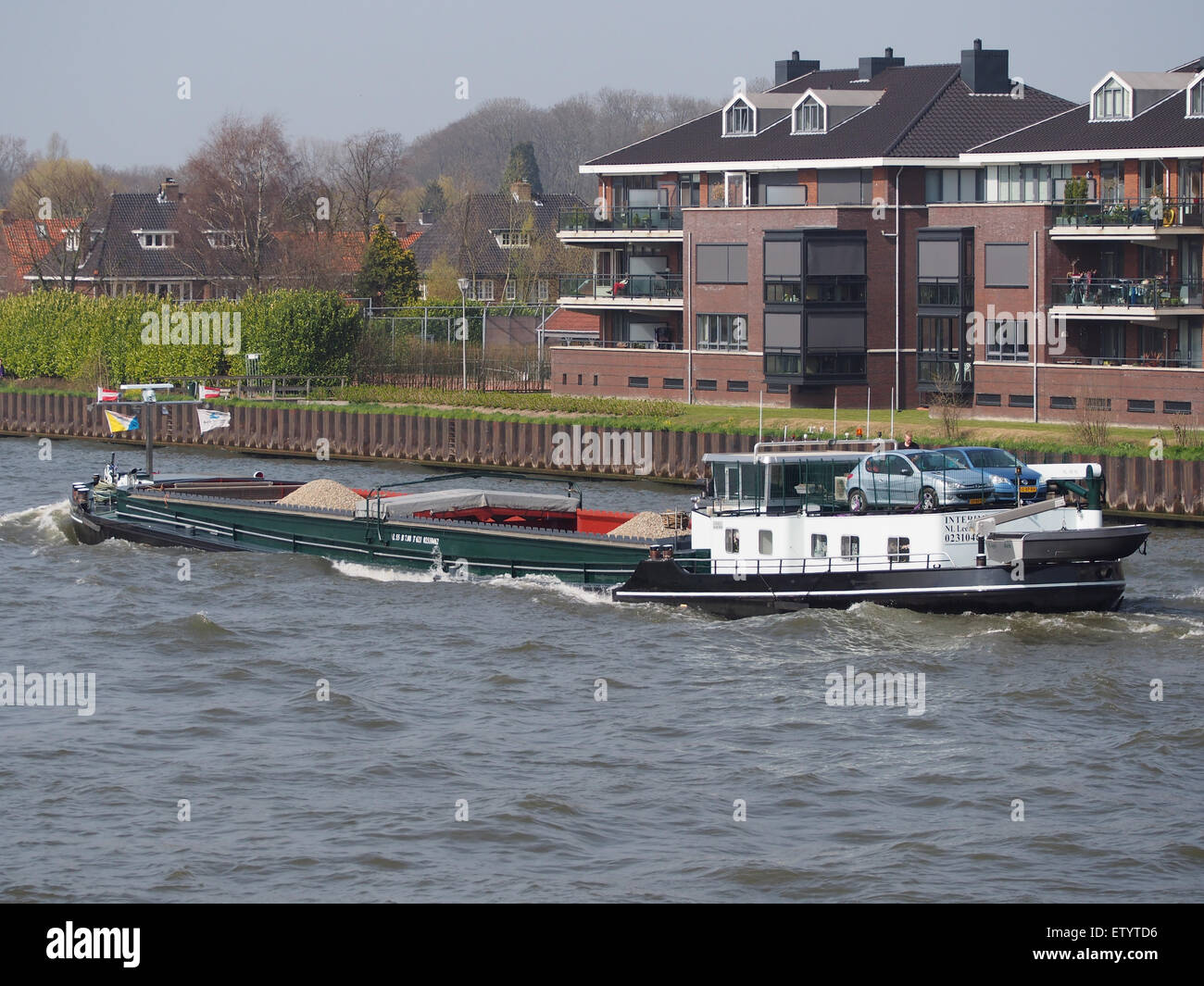 The photograph shows a tanker ship, 'Interim,' navigating the Amsterdam ...