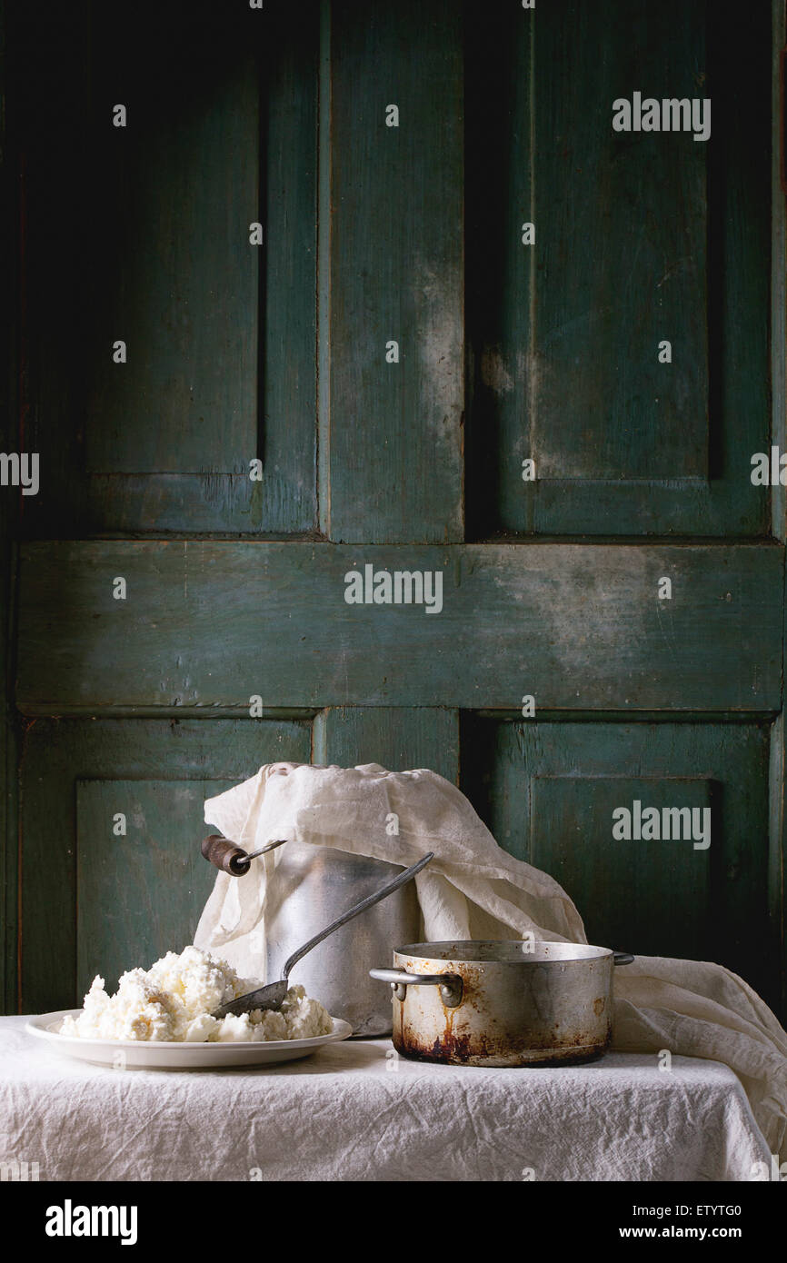 Plate of homemade cottage cheese, served with vintage aluminum pan and ...
