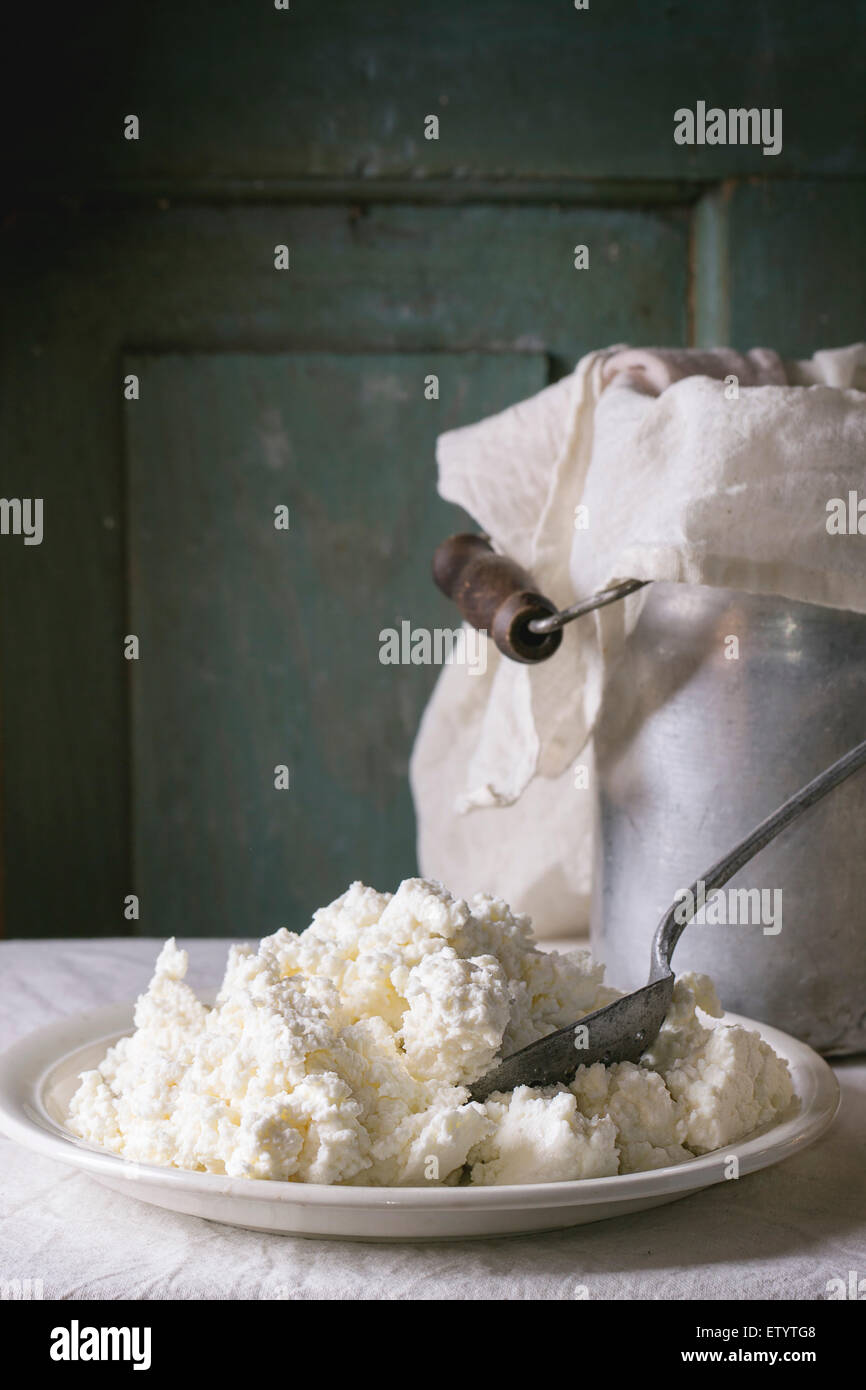 Plate of homemade cottage cheese, served with vintage aluminum pan and ...