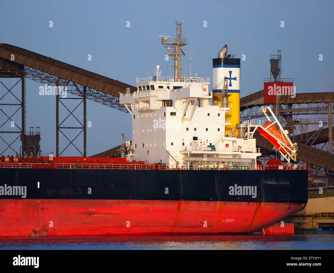 The image depicts the Polymnia, an oil tanker, docked at Beneluxhaven ...