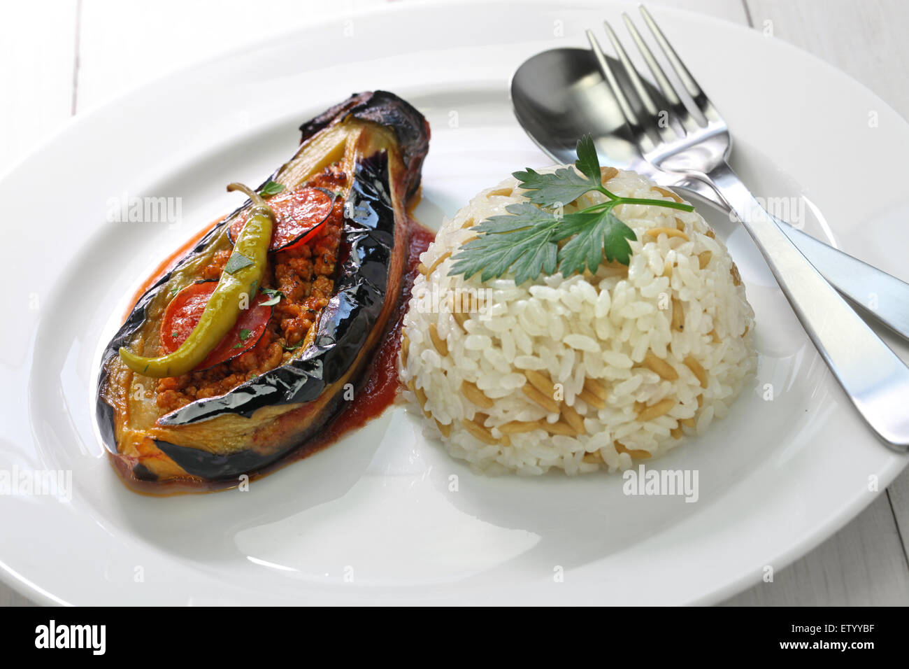 karniyarik pilav, stuffed eggplant with pilaf, turkish cuisine isolated ...