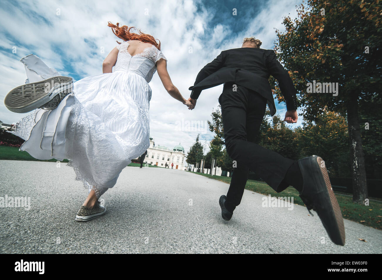 Wedding couple on a walk Stock Photo - Alamy