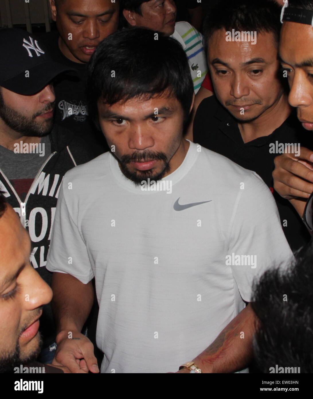 Professional boxer Manny Pacquiao sports a black eye as he leaves the ...