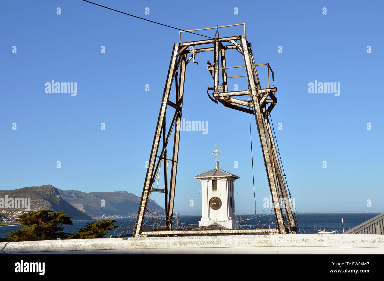 Old aerial rope way support and dockyard clock tower in Simon's Town ...