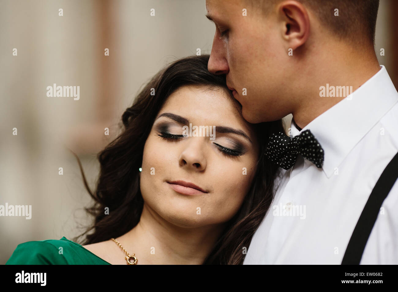 European beautiful couple posing on the street Stock Photo - Alamy