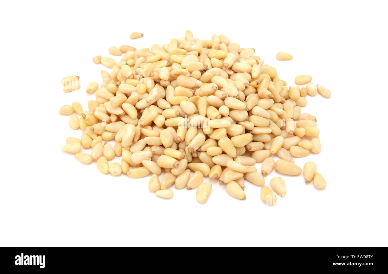 Pine nuts, isolated on a white background Stock Photo - Alamy