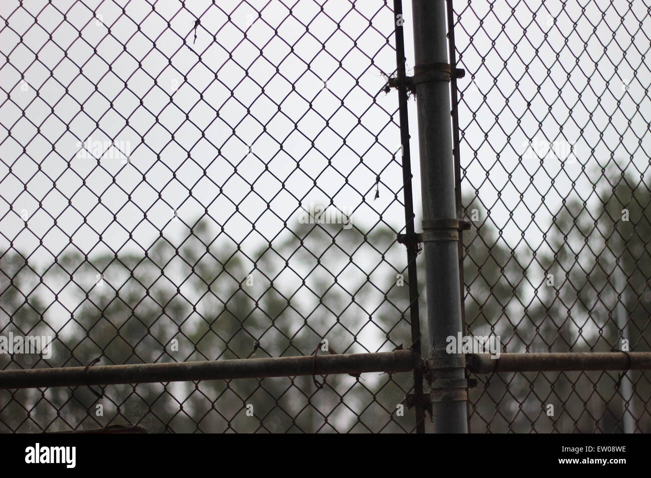 A wire fence sits abandoned on an overcast day Stock Photo - Alamy