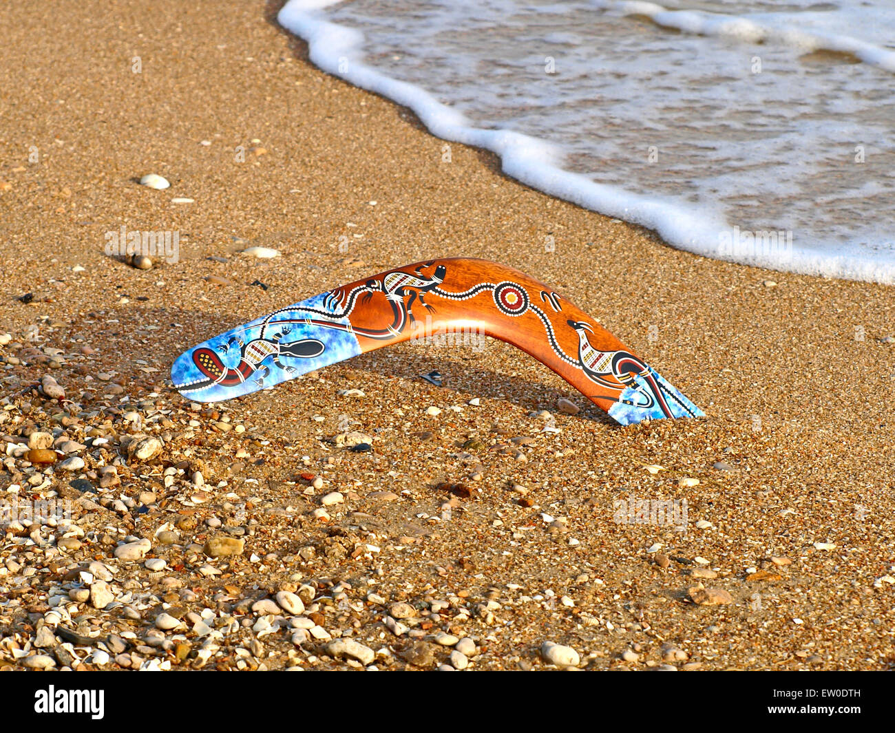 Colorful boomerang on a sandy beach Stock Photo - Alamy
