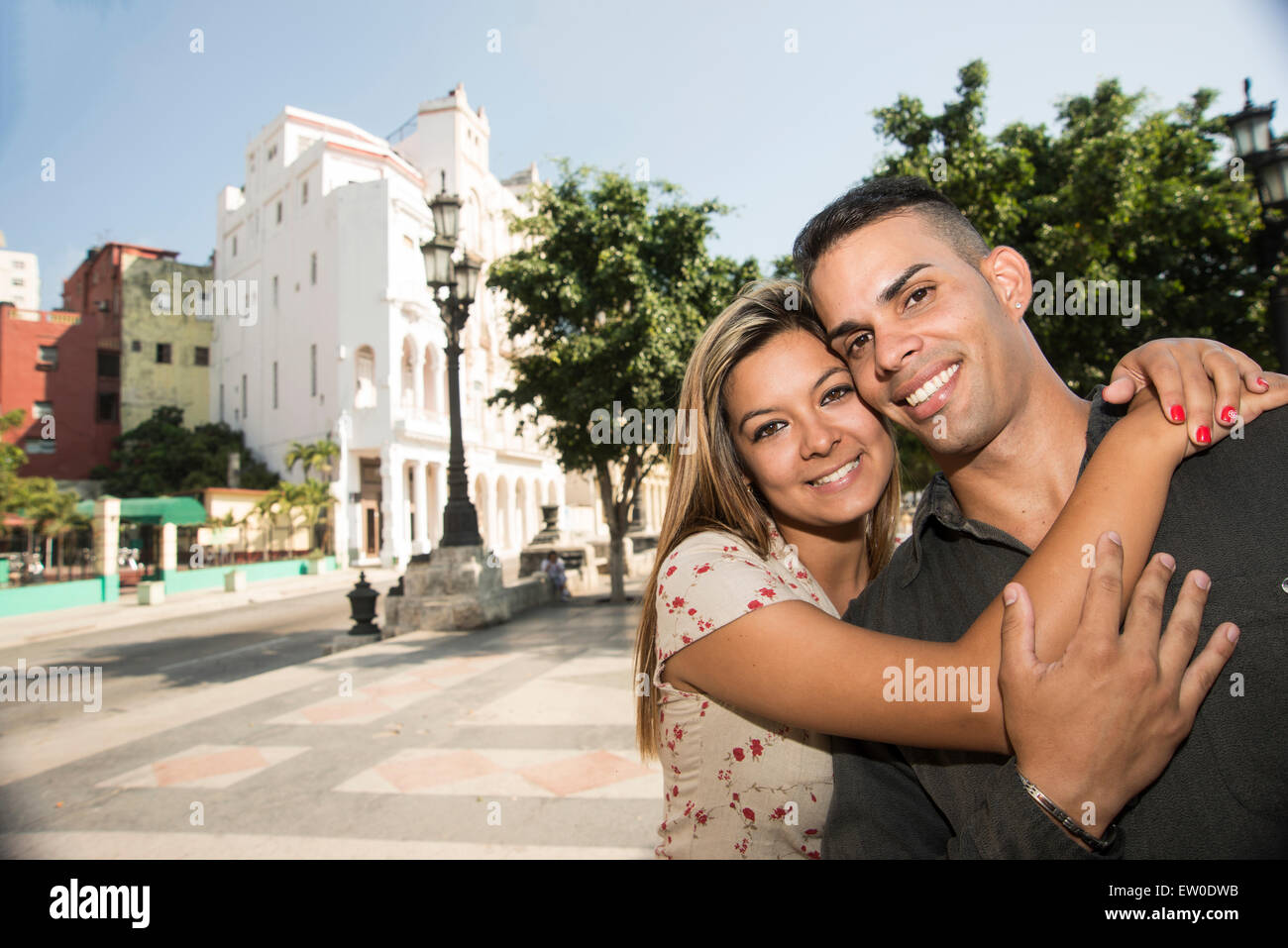 A young Latin couple outdoors Stock Photo - Alamy