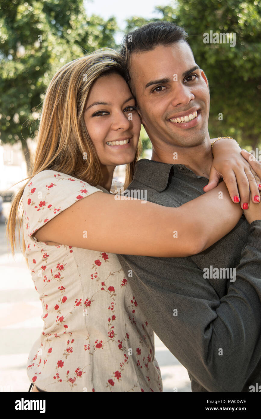 A young Latin couple outdoors Stock Photo - Alamy