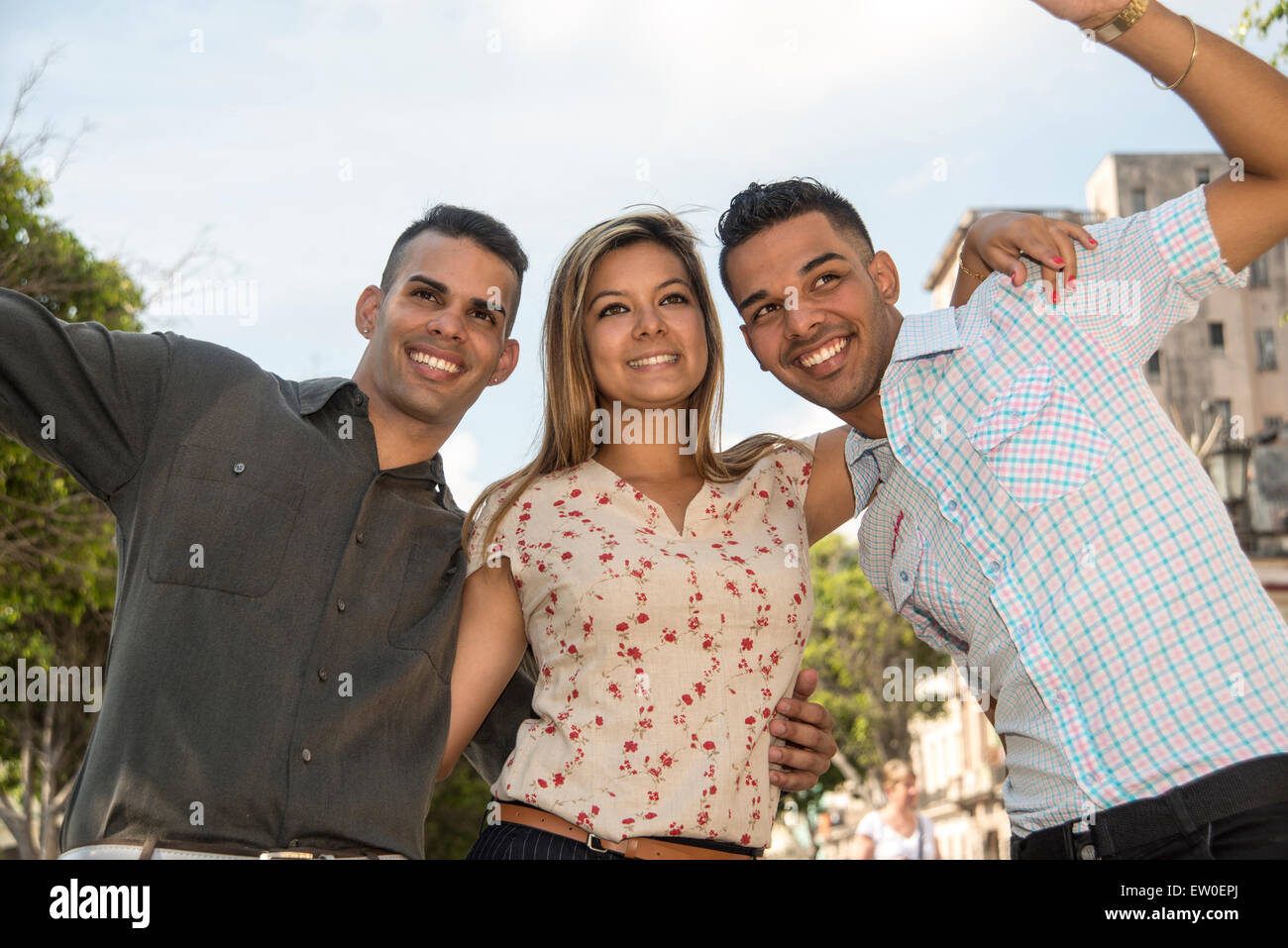 Three friends walking having fun hi-res stock photography and images ...
