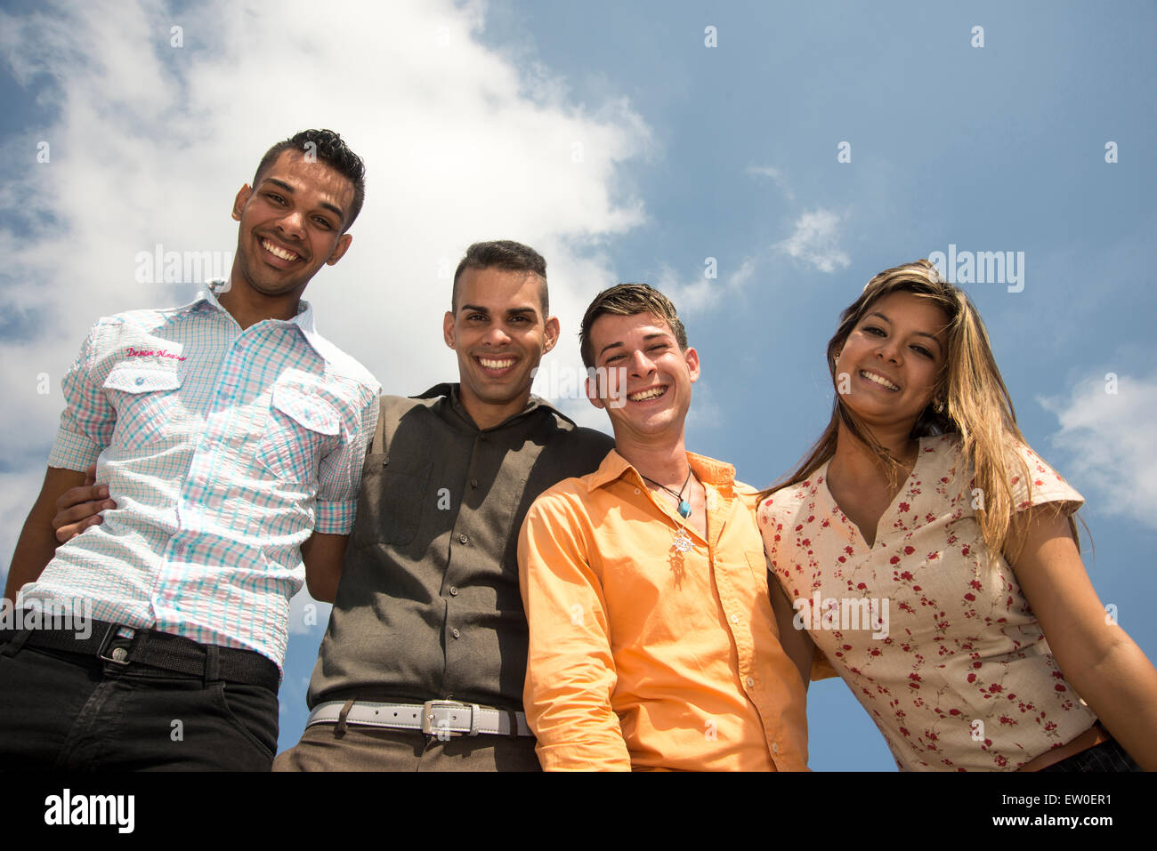 Four young Latin people having fun Stock Photo - Alamy