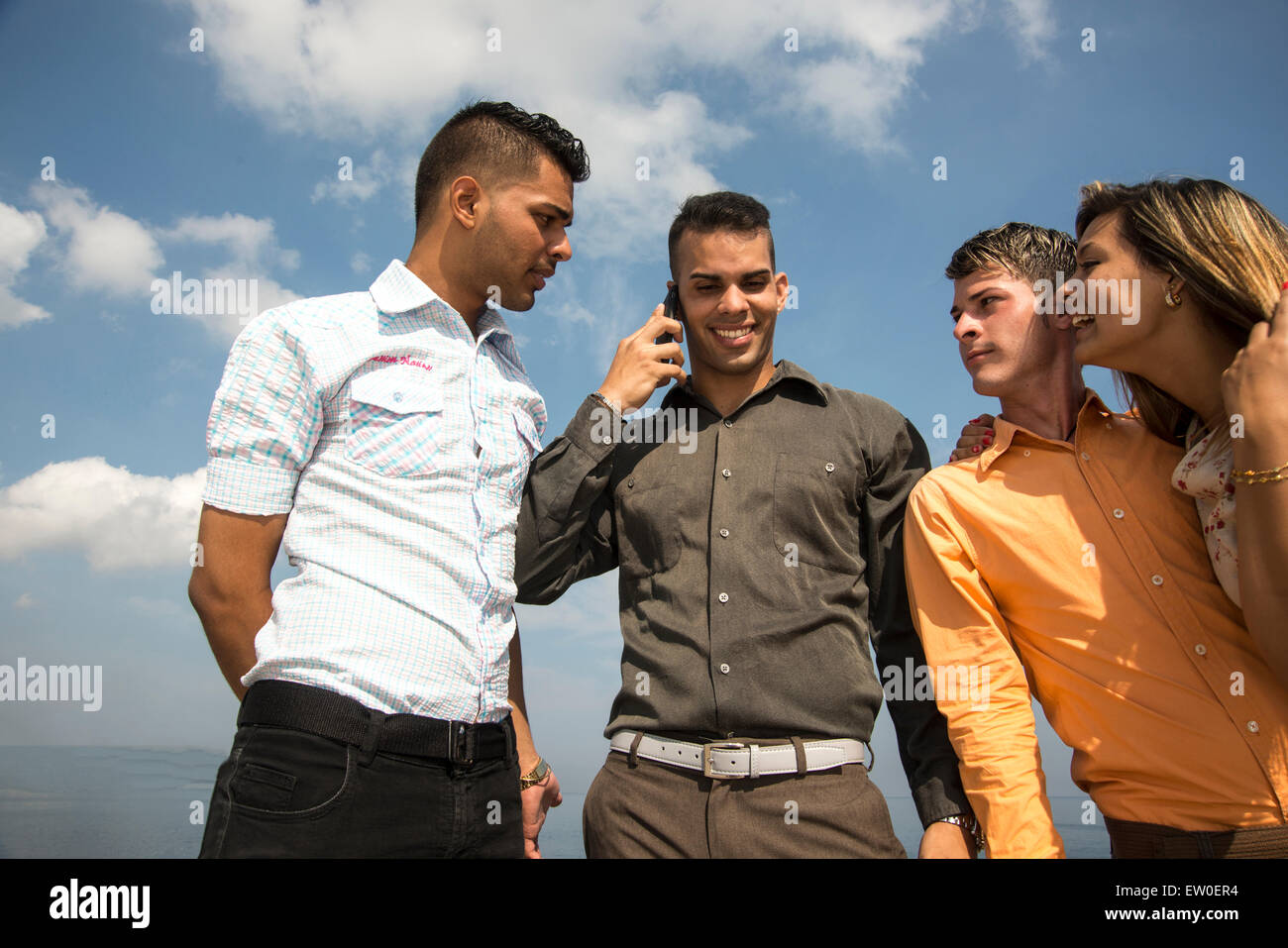 Four young Latin people Stock Photo - Alamy