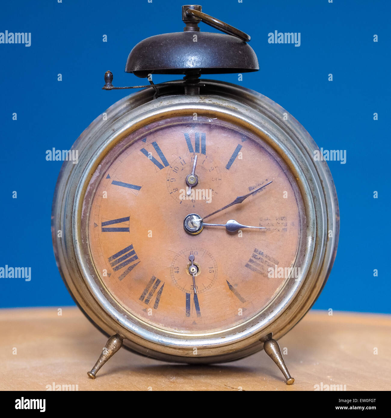 Vintage table alarm clock on wooden desk, retro style Stock Photo - Alamy