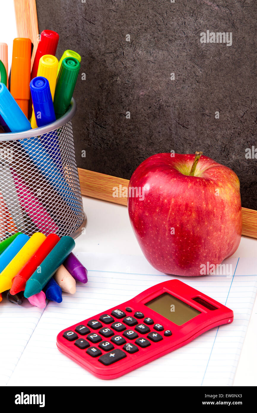 Doing homework with crayons and calculator Stock Photo - Alamy