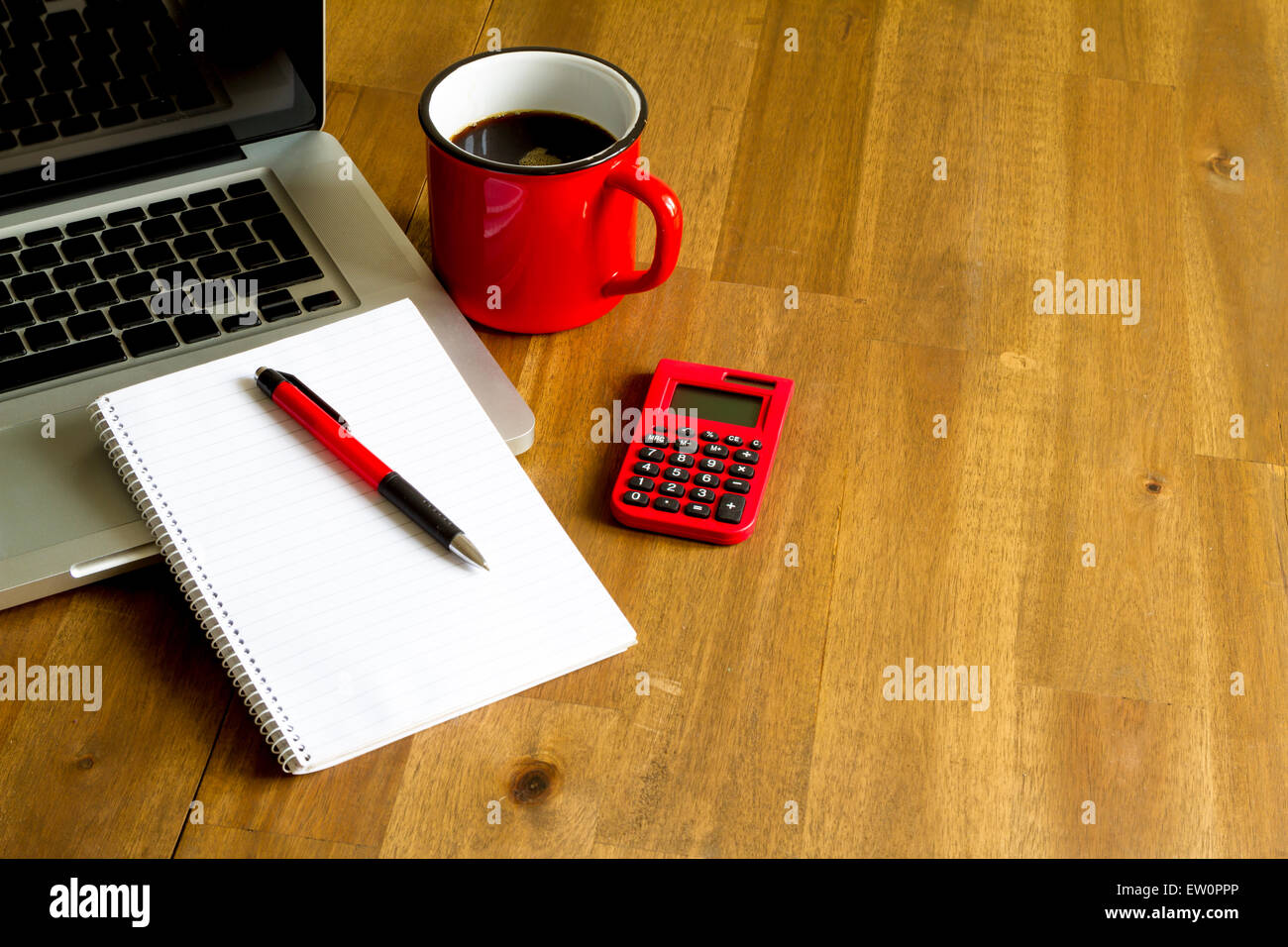 Working with the laptop, taking notes and doing calculations Stock ...