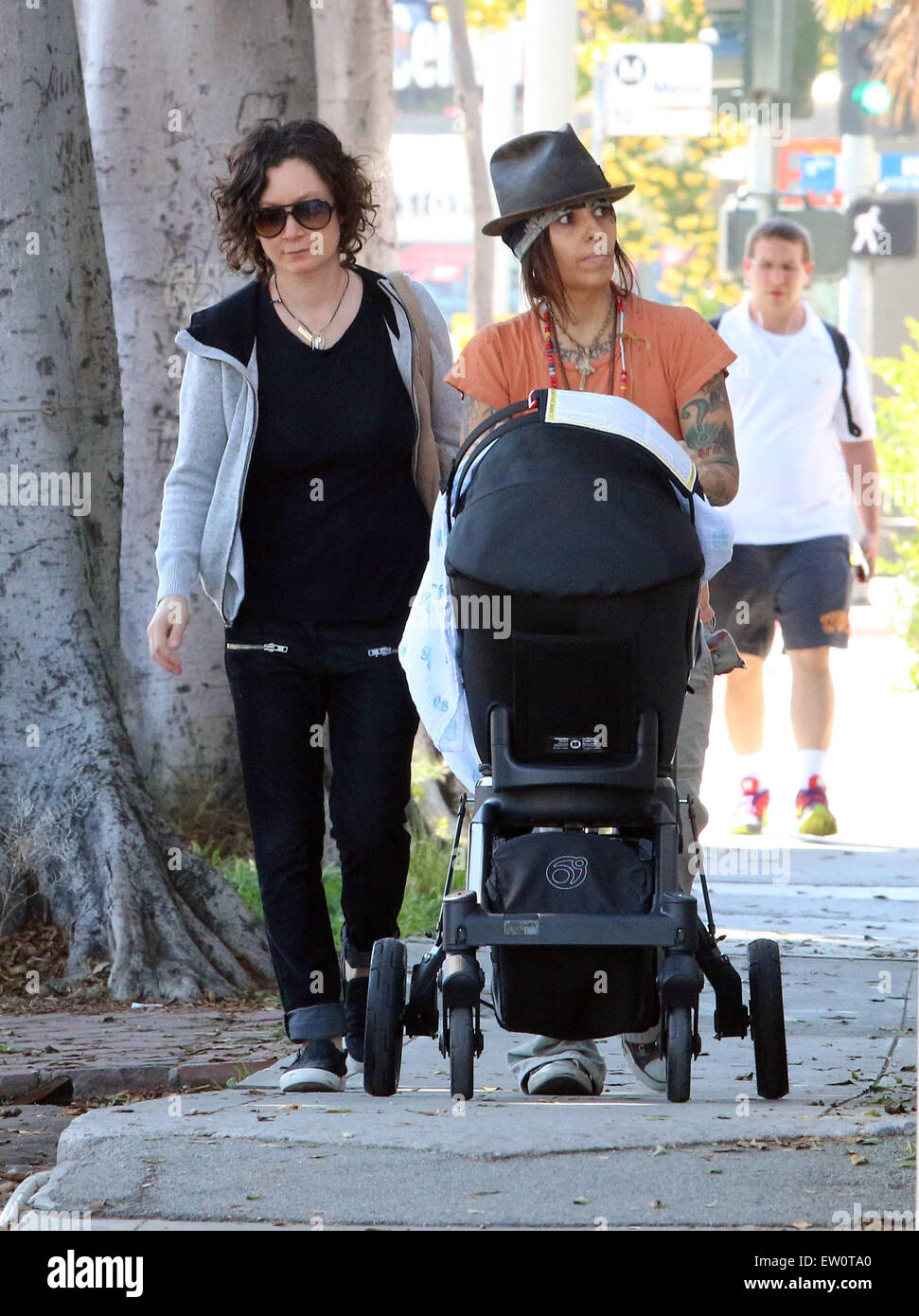 Sara Gilbert and wife Linda Perry take their newborn son Rhodes on a ...